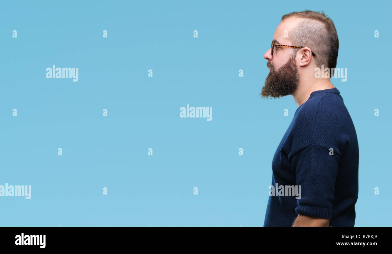 Young caucasian hipster man wearing sunglasses over isolated background ...