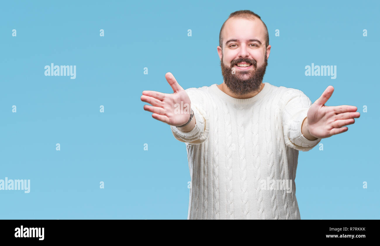 Young caucasian hipster man wearing winter sweater over isolated ...