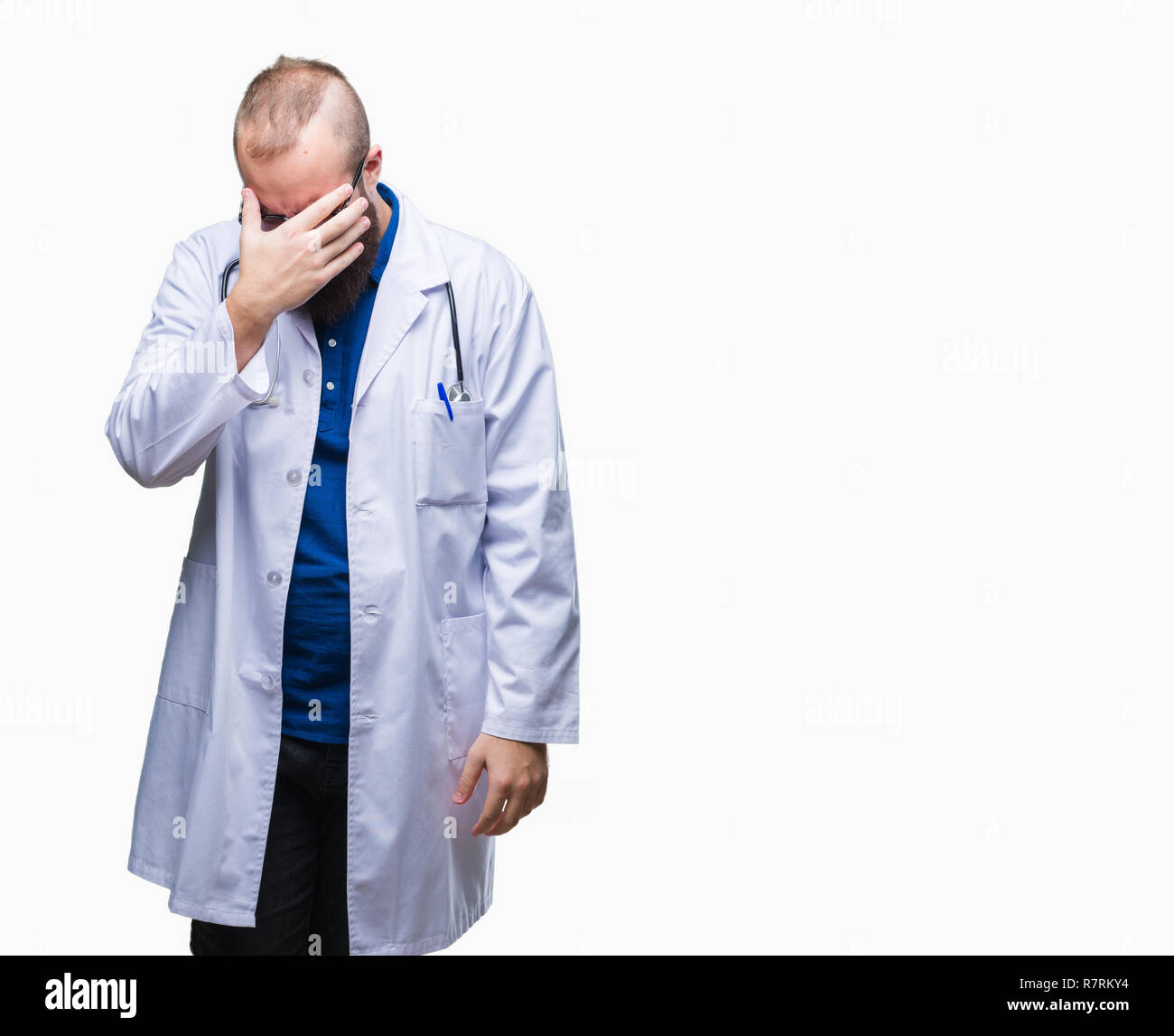 Young caucasian doctor man wearing medical white coat over isolated ...