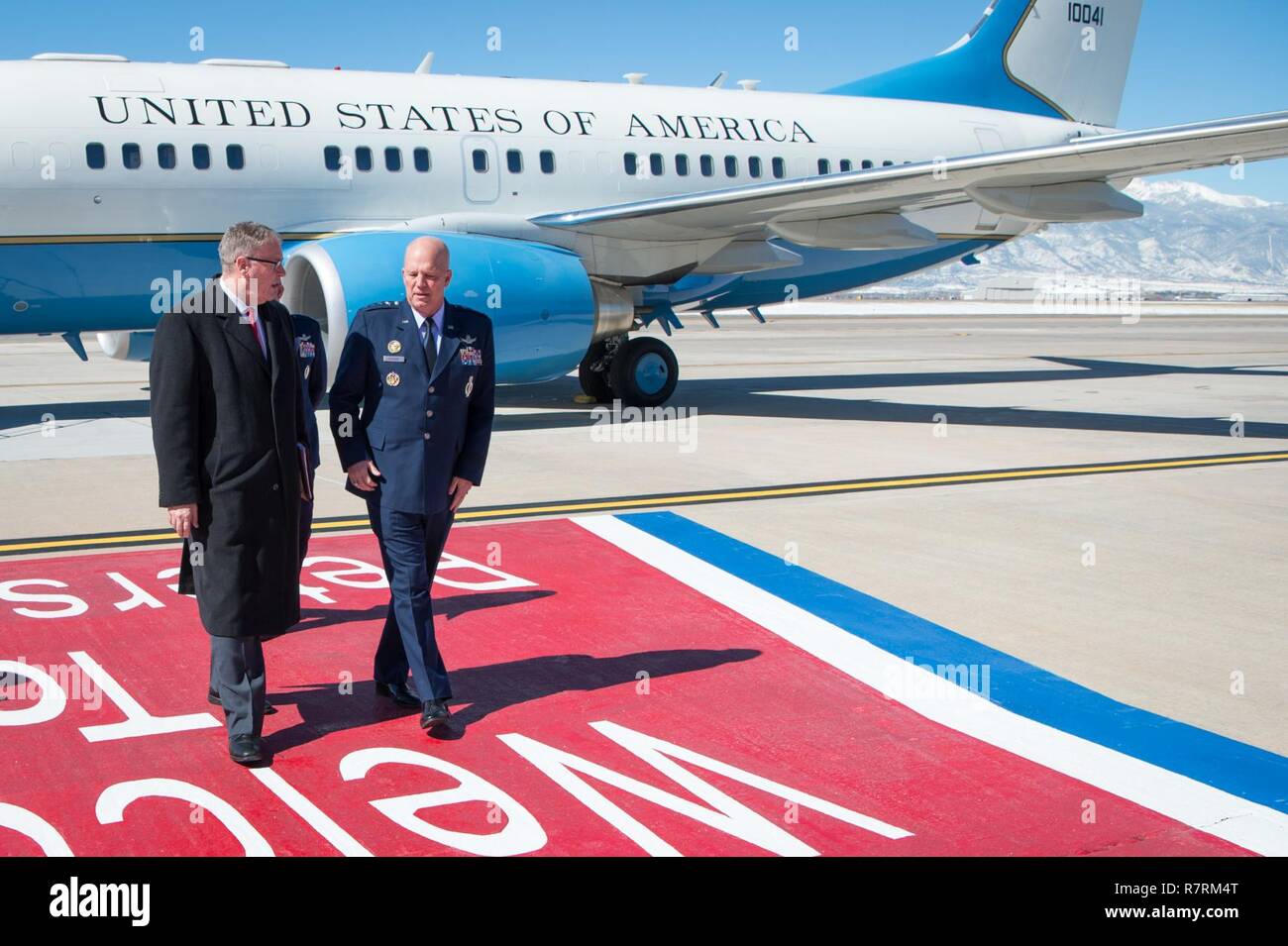 Deputy Secretary of Defense Bob Work is met by U.S. Air Force Gen. John ...