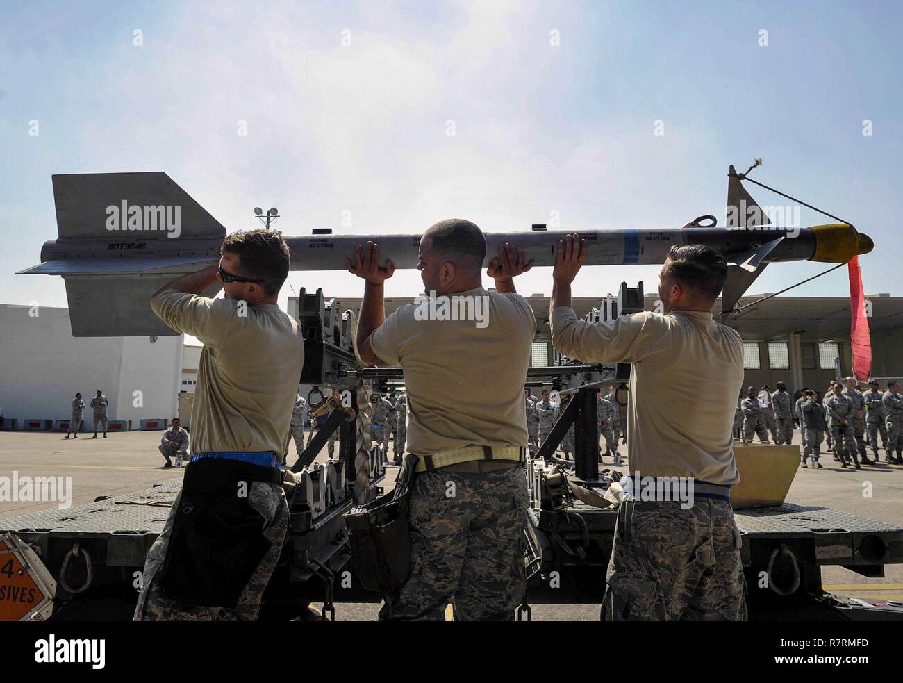 A U.S. Air Force weapons load crew team from the 44th Aircraft ...