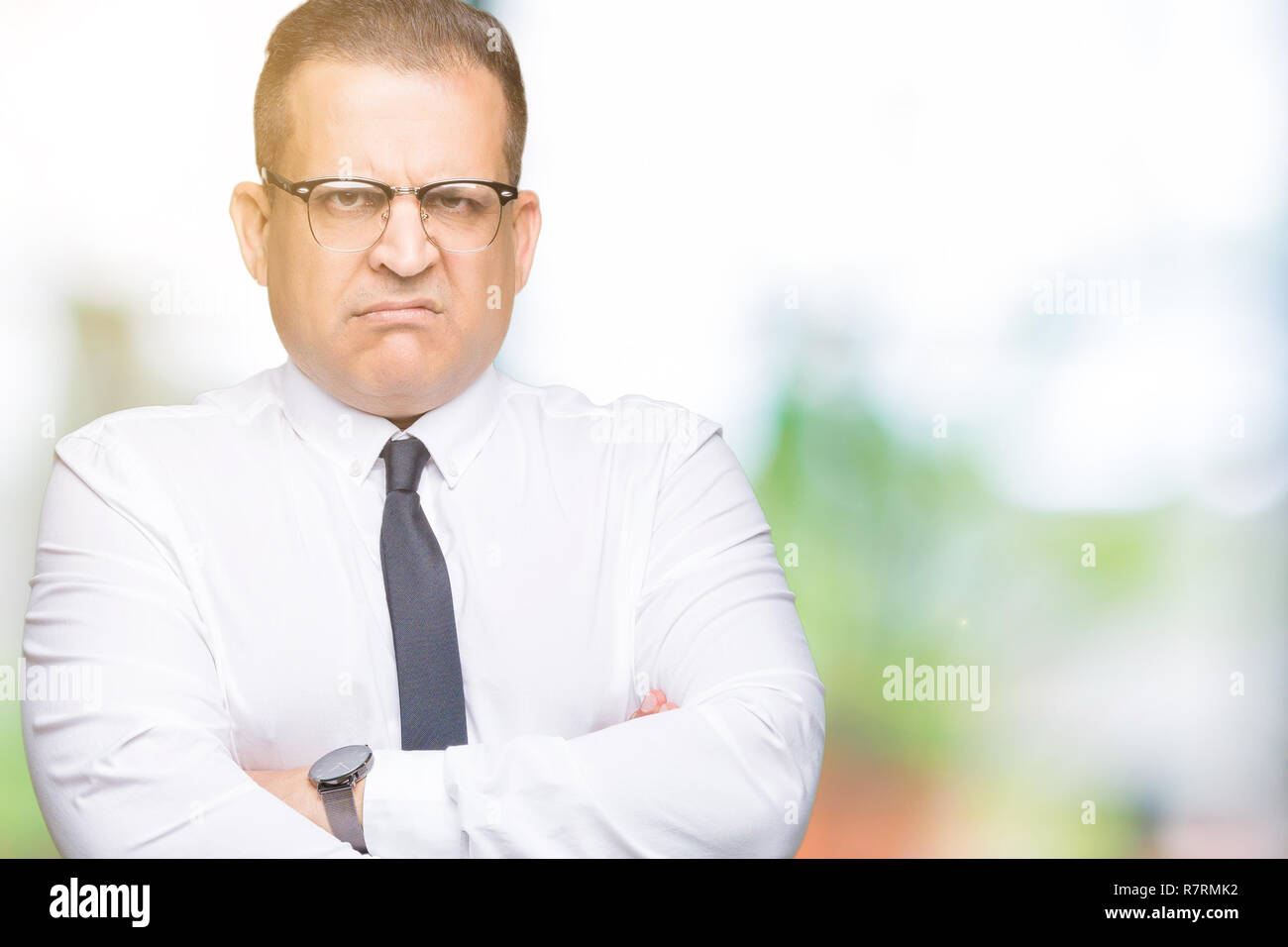 Middle age bussines arab man wearing glasses over isolated background ...
