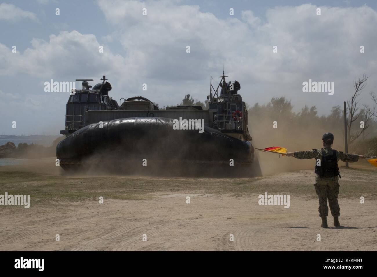 A Navy Landing Craft, Air-Cushioned hovercraft with the Bonhomme ...