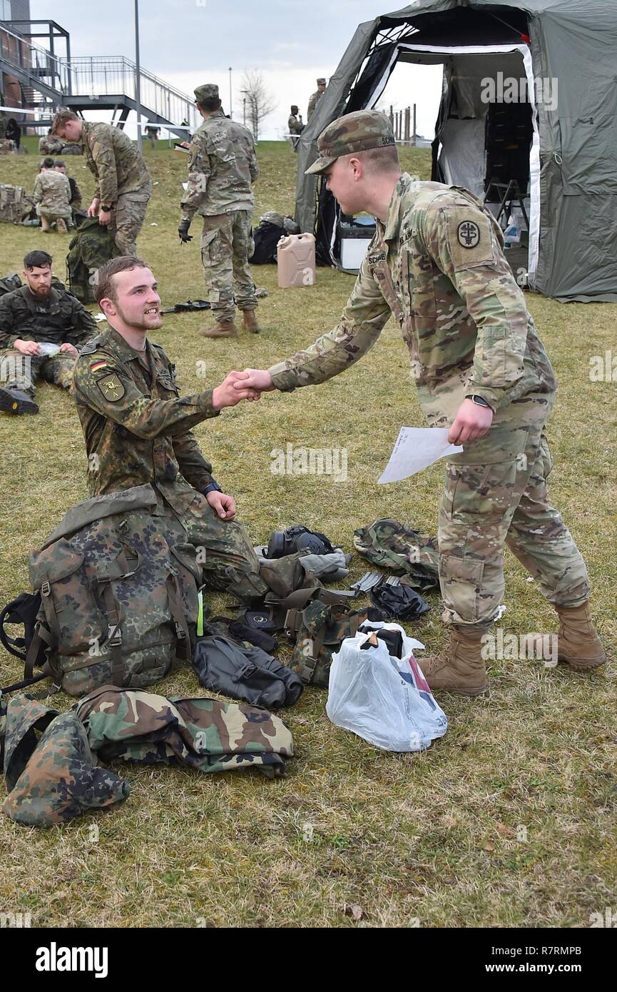 A U.S. Soldier with U.S. Army Medical Materiel Center Europe, right ...