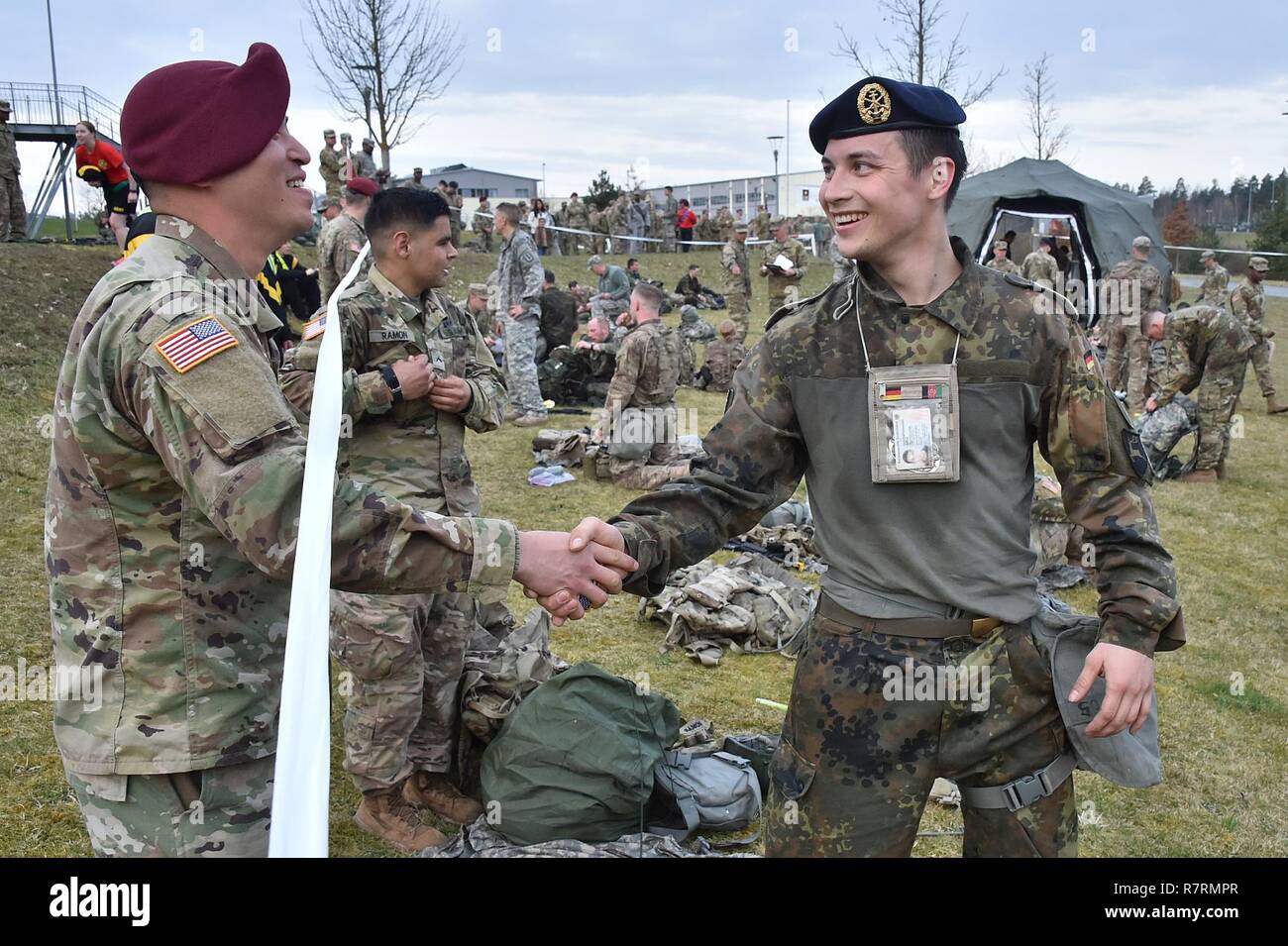 A U.S. Soldier with 173rd Airborne Brigade, left, congratulates a ...