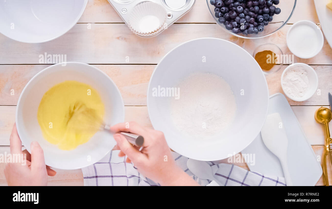 Mixing ingredients together in mixing bowl for blueberry muffins Stock ...