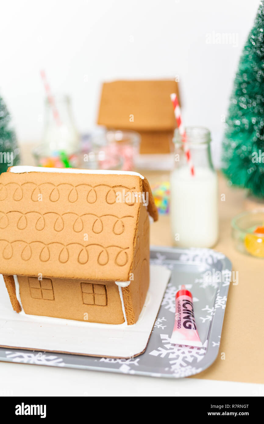 Kids party to decorate small gingerbread houses with candies Stock ...