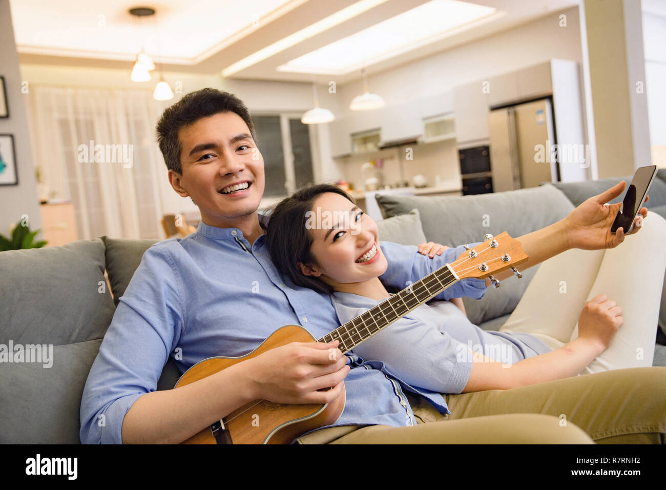 Romantic couples in the living room Stock Photo - Alamy