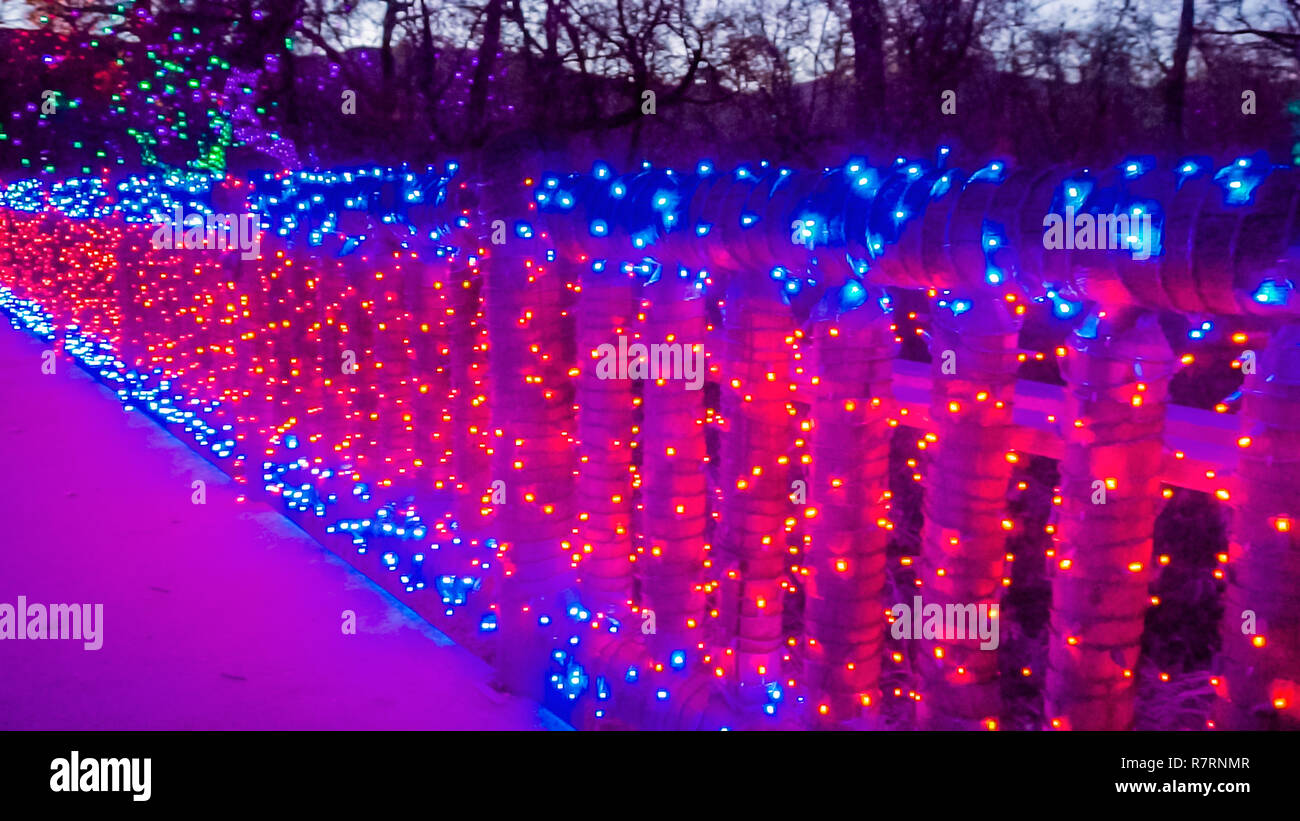 Wooden bridge decorated with red and blue Christmas lights Stock Photo ...