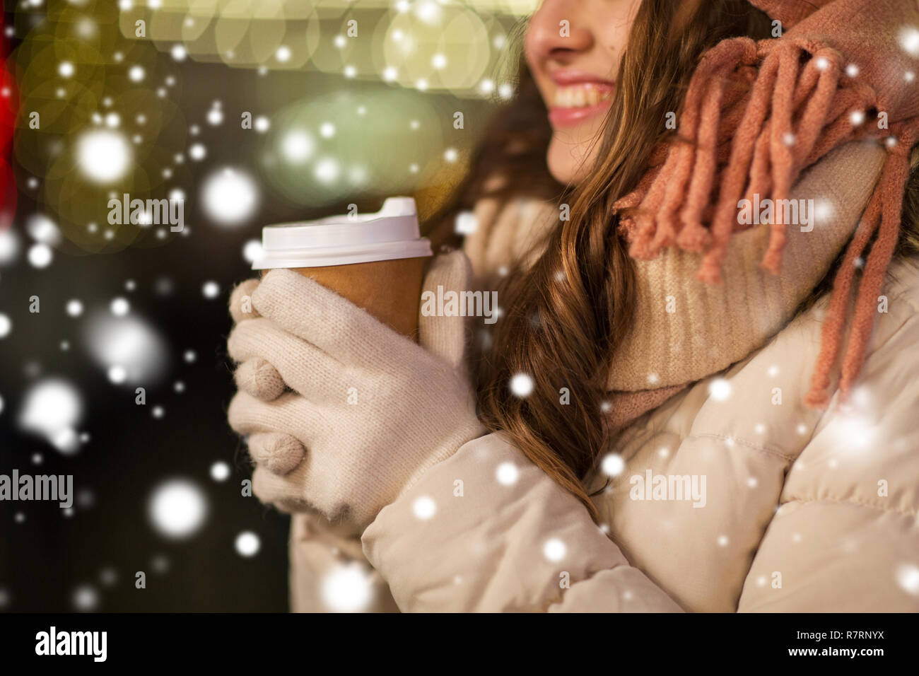 happy woman with coffee over christmas lights Stock Photo - Alamy