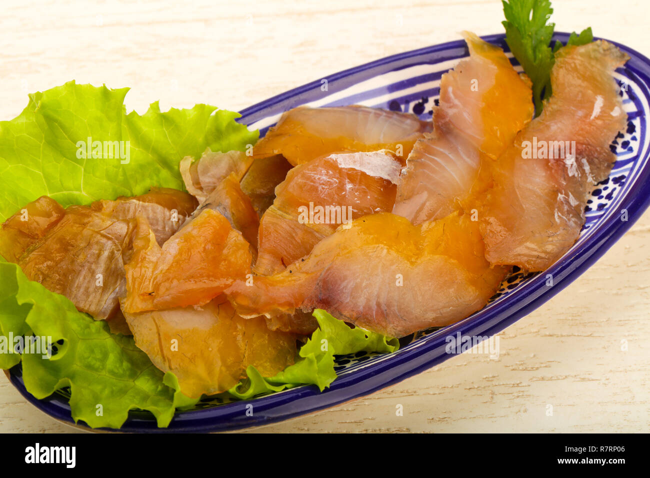 Smoked catfish fillet carpaccio Stock Photo - Alamy
