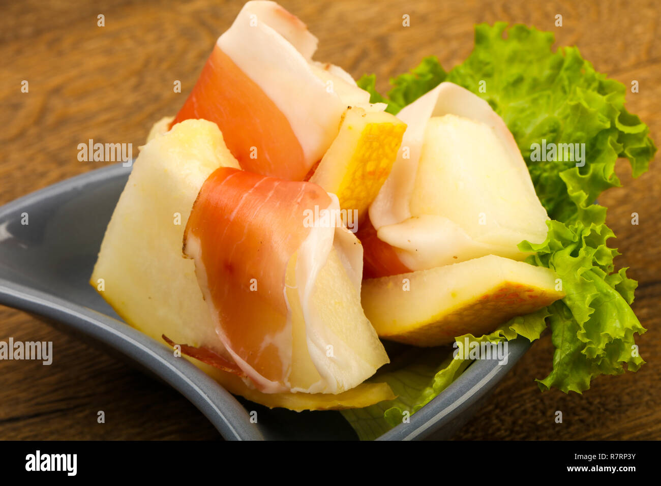 Spanish Hamon with melon Stock Photo - Alamy