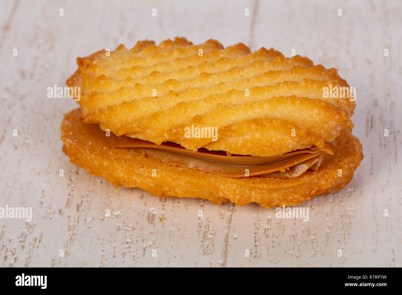 Sweet tasty cookies ower wooden background Stock Photo - Alamy