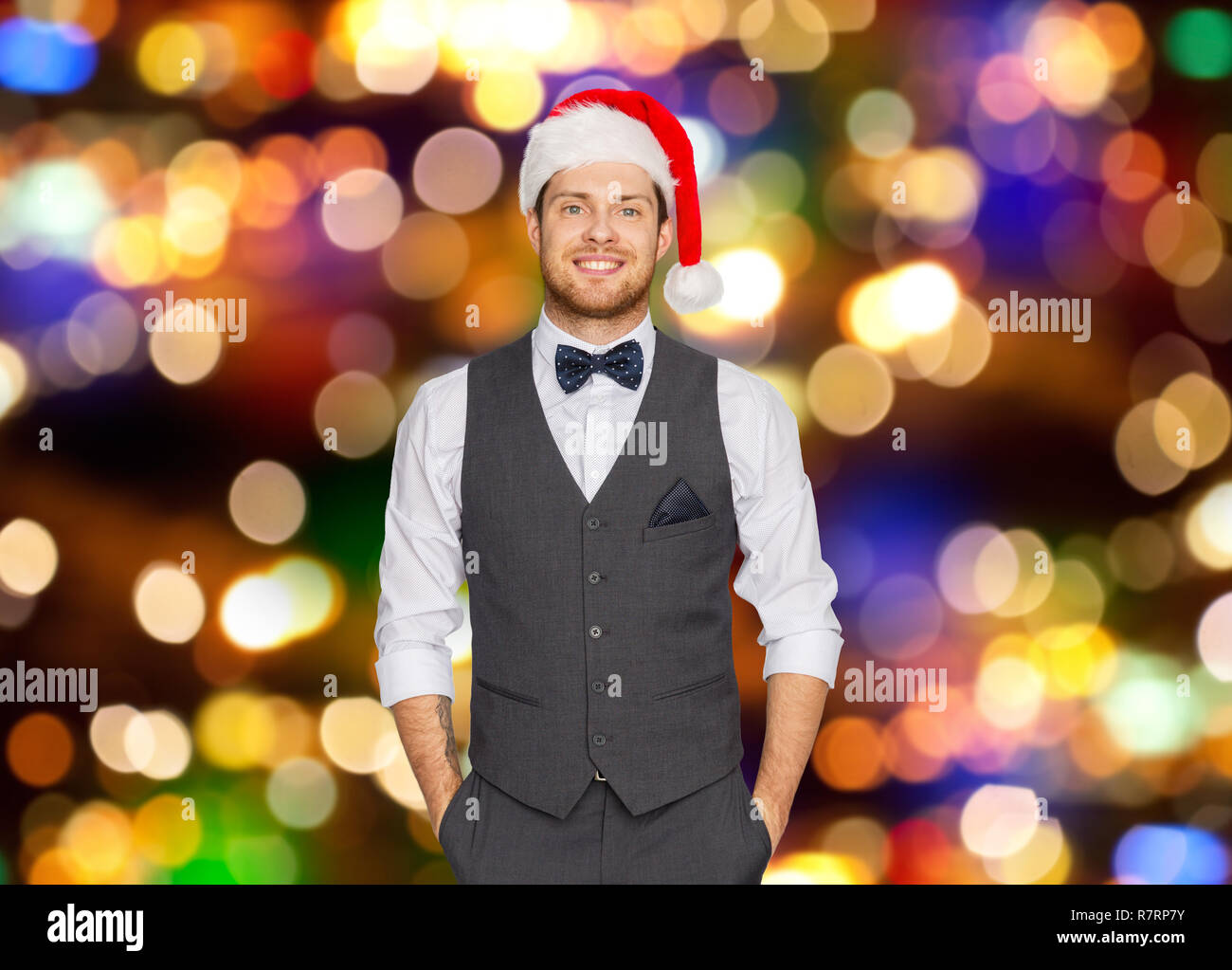 happy man in santa hat and suit at christmas Stock Photo - Alamy