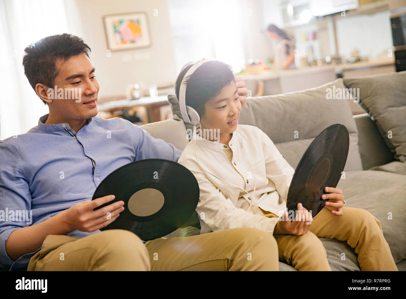 The father and his son to listen to music Stock Photo - Alamy