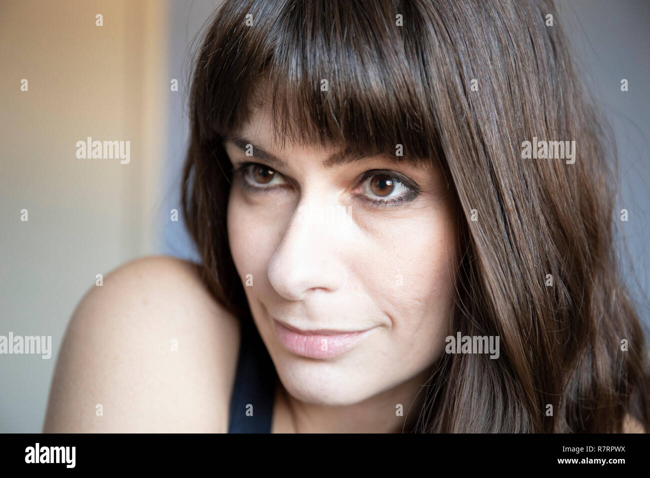 Young woman close-up three quarters portrait. Caucasian with brown long ...