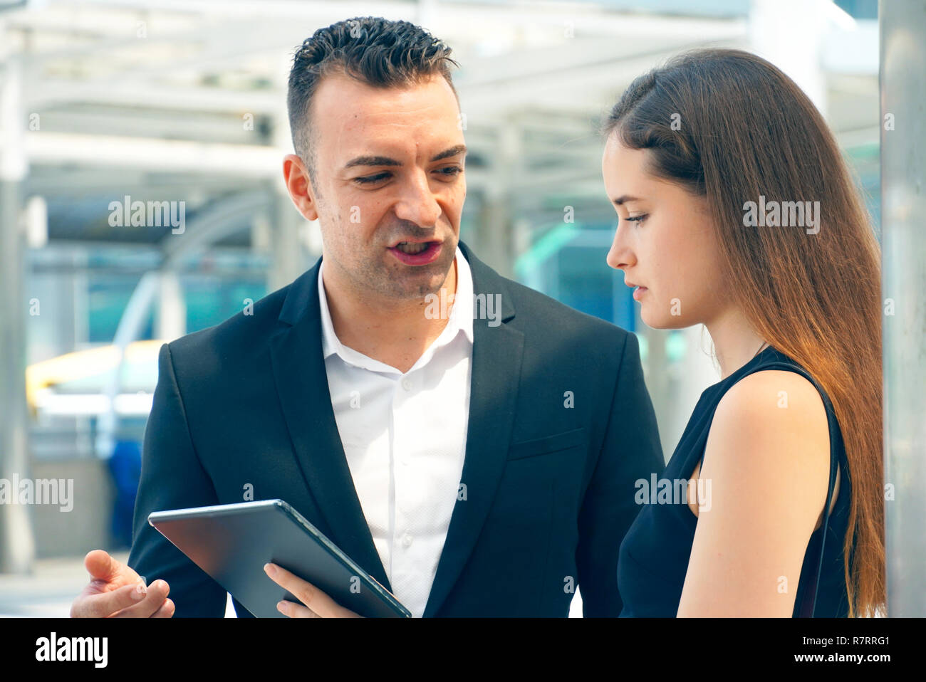 Businessman and secretary planning business together Stock Photo - Alamy