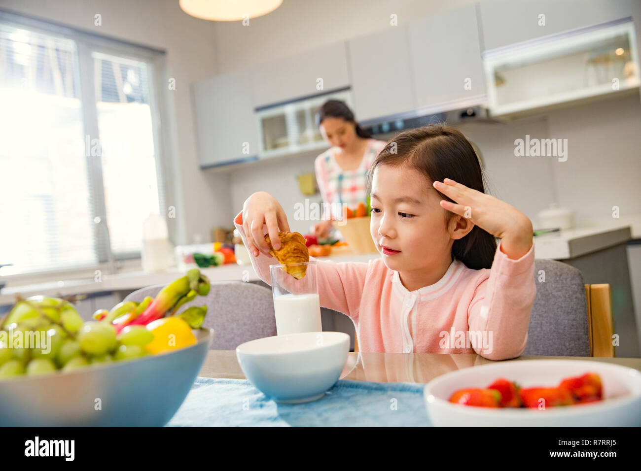 Happy family was eating breakfast Stock Photo - Alamy