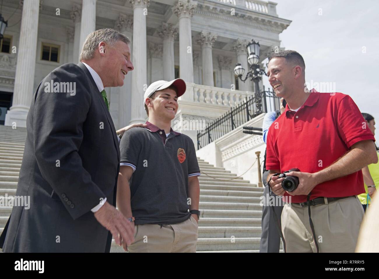 Sen. Richard Burr (left) speaks with Jackson Beatty (center), Marine ...