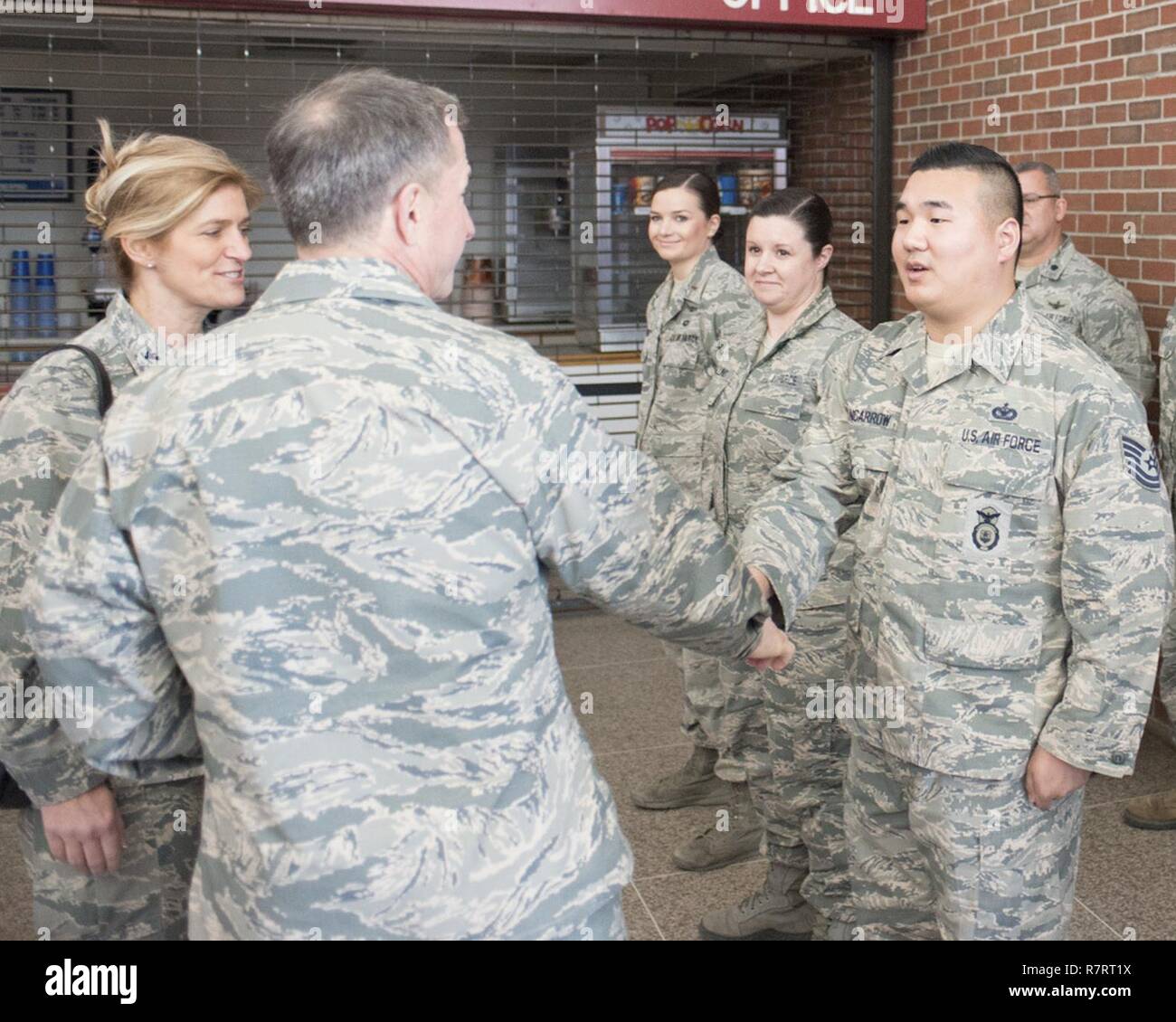 Air Force Chief of Staff Gen. David L. Goldfein coins Tech. Sgt. Allen Nancarrow of the 102nd ...