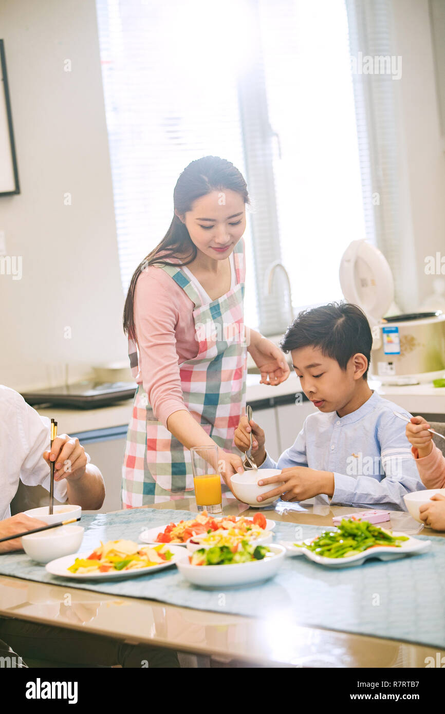 Happy family at dinner Stock Photo - Alamy
