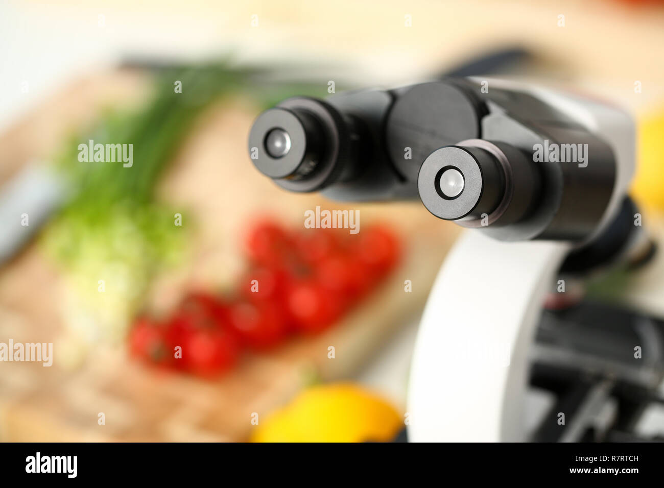 Microscope head on kitchen background Stock Photo - Alamy