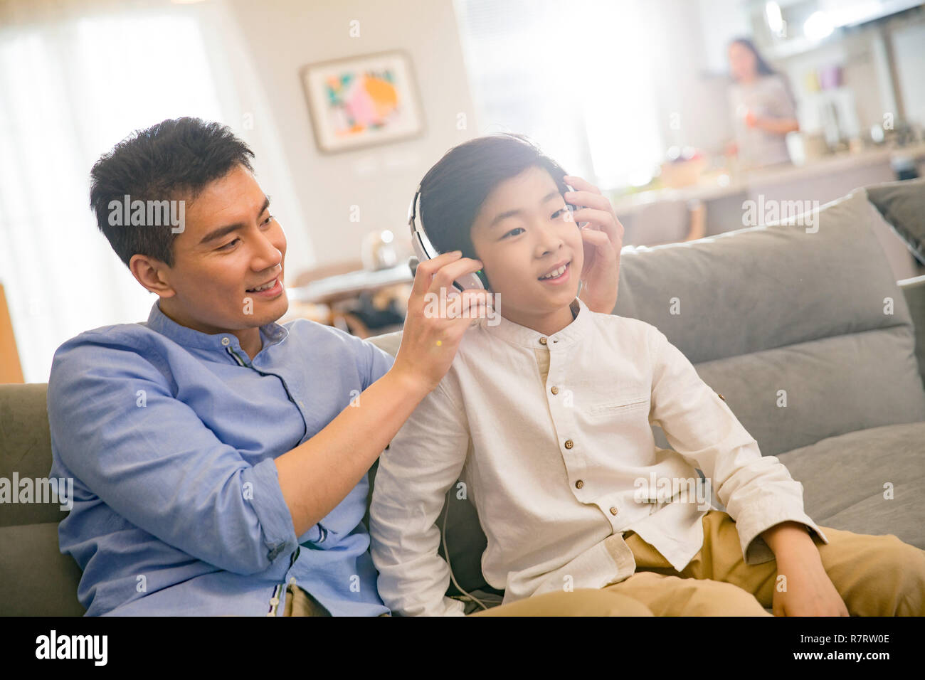 The father and his son to listen to music Stock Photo - Alamy