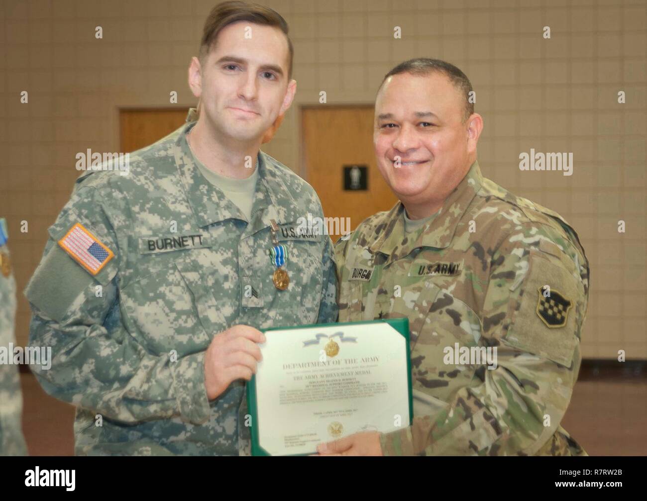 Brig. Gen. Jose Burgos, Deputy Commanding General, 99th Regional Support Command (right) poses ...