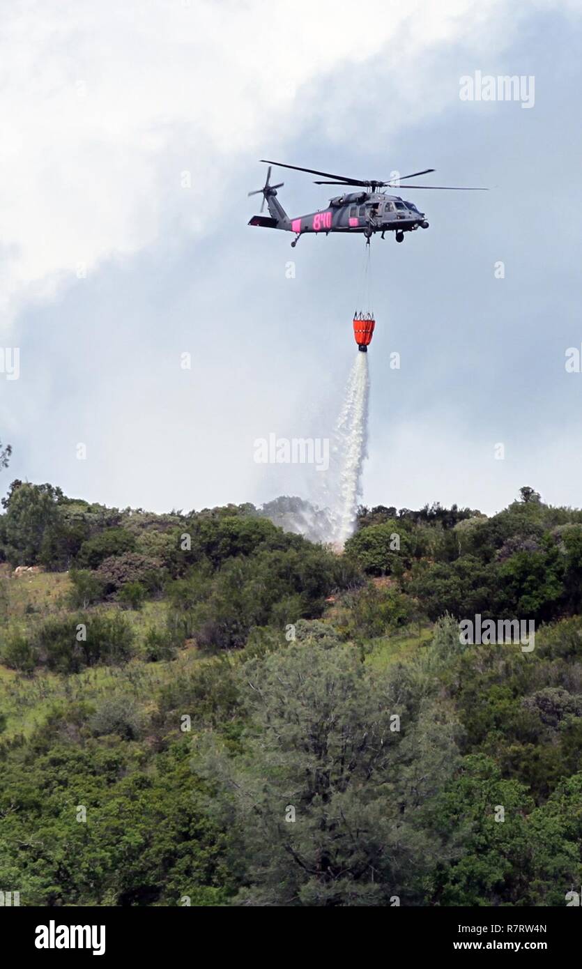 A California National Guard UH-60 Black Hawk drops water near Pardee ...