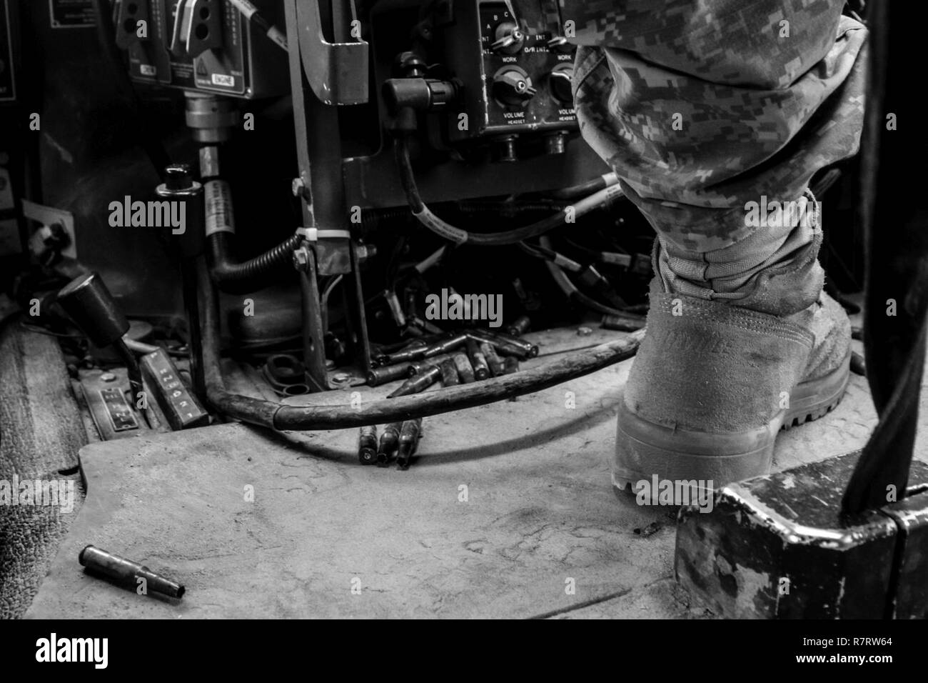 Expended shell casings fall into a Humvee from the gunner position ...