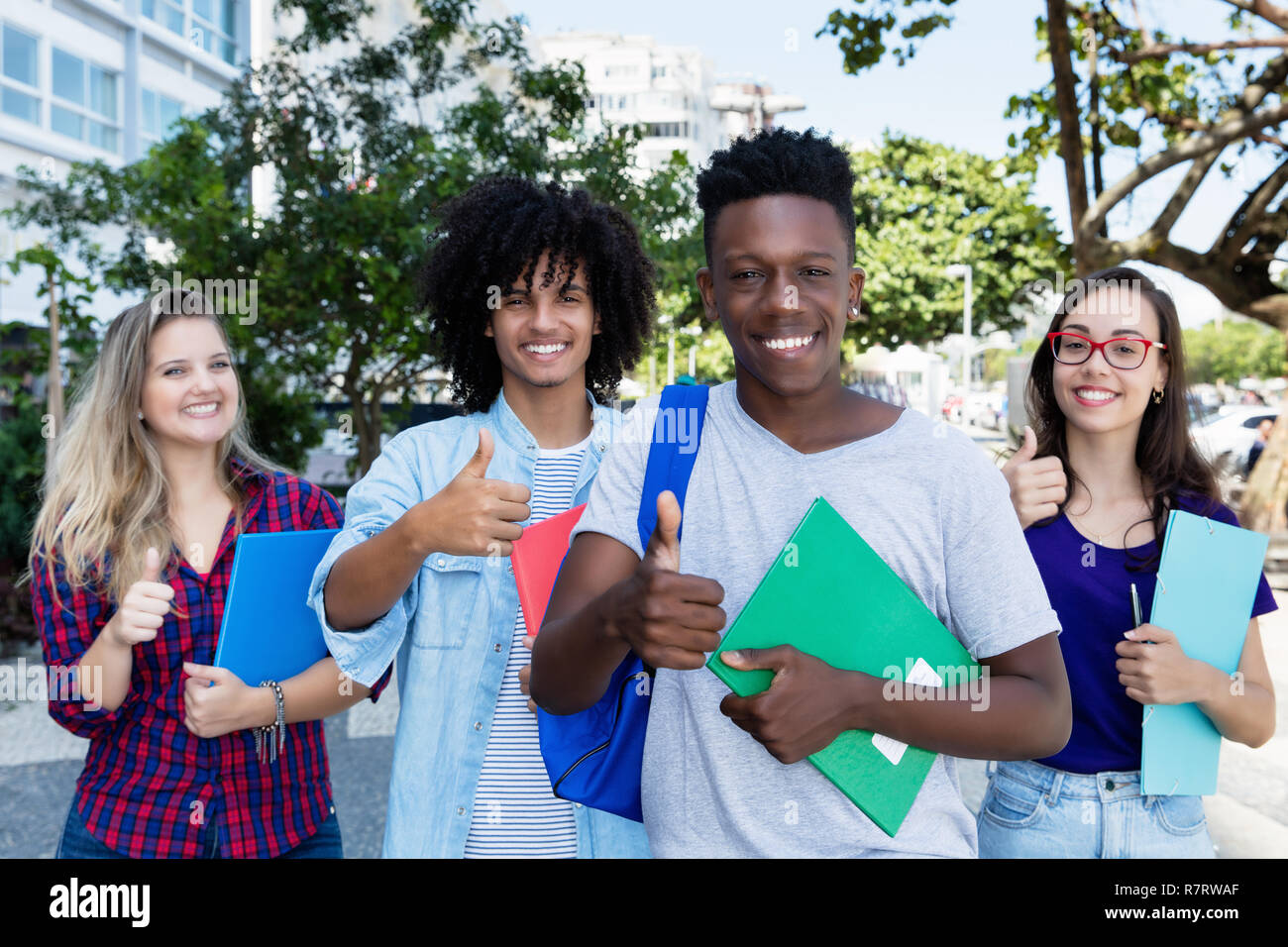 Successful african american student with group of internternational ...