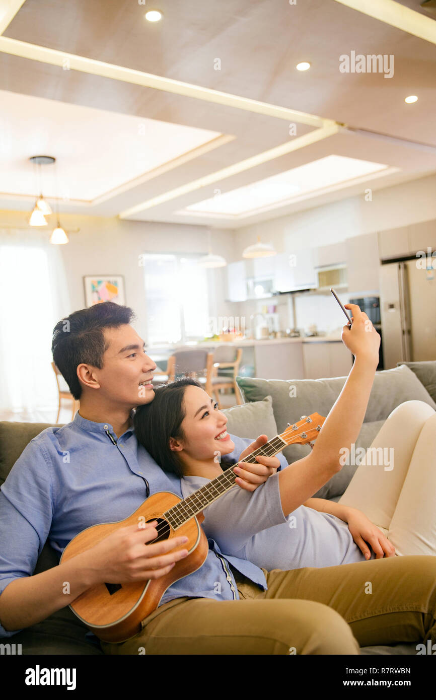 Romantic couples in the living room Stock Photo - Alamy