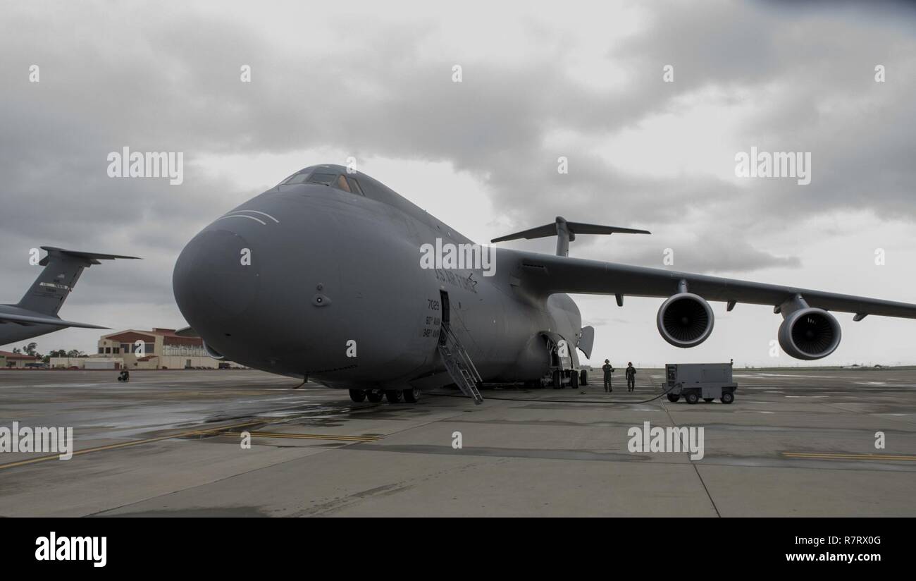C-5 M Super Galaxy aircraft parked on the ramp on a rainy morning at Travis AFB, California, Apr ...