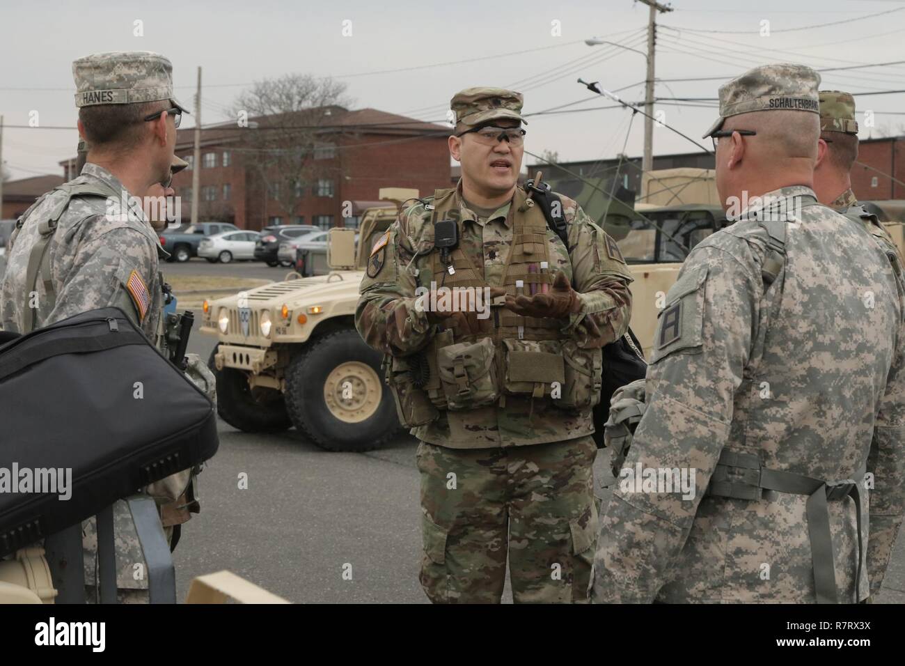 U.S. Army Reserve Soldiers huddle up around a First Army observer coach ...