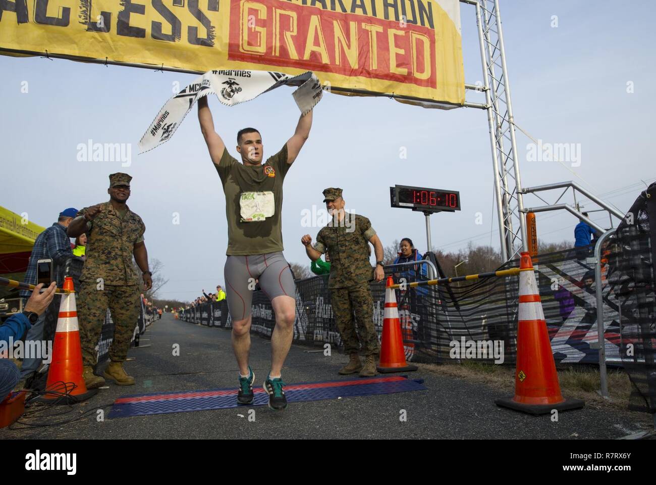 Andrew Harper crosses the finish line as the first place finisher of ...