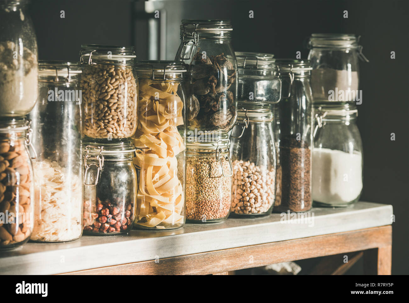 Rustic kitchen food storage arrangement over kitchen counter Stock ...