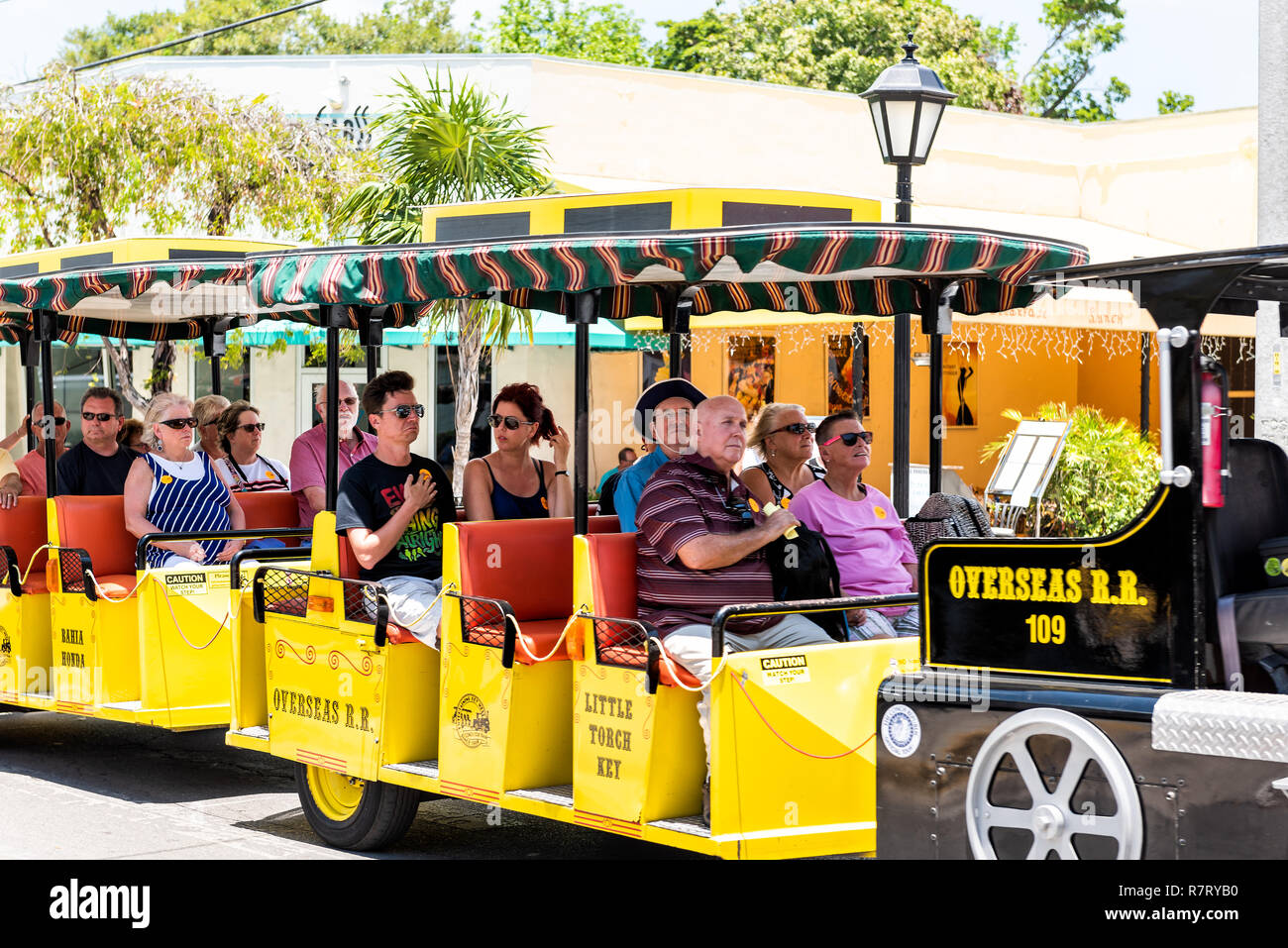 Key West, USA - May 1, 2018: People riding tour bus conch trolley happy ...