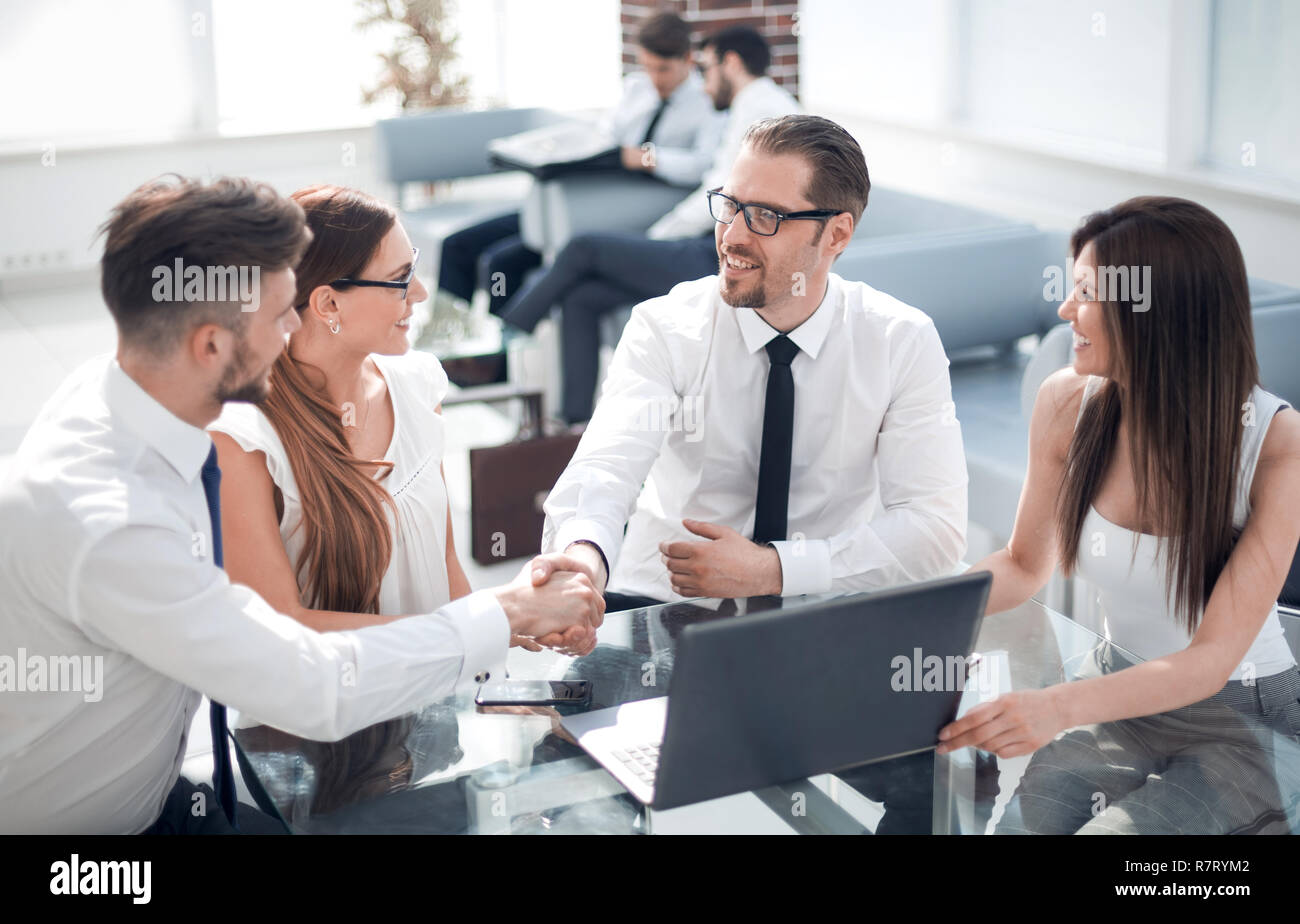 handshake business people at the Desk Stock Photo - Alamy