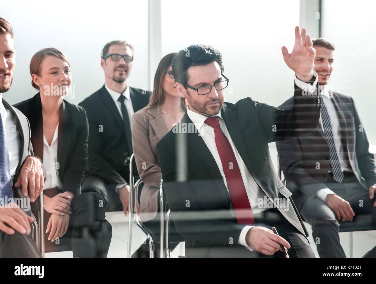 businessman raising his hand Stock Photo - Alamy