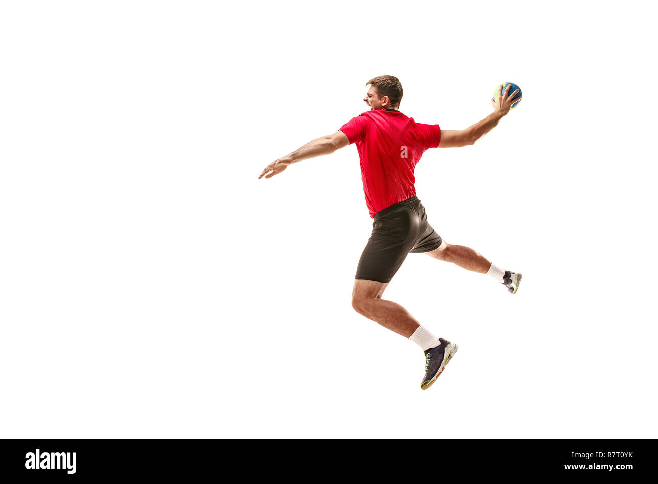 The fit caucasian young male handball player at studio on white ...