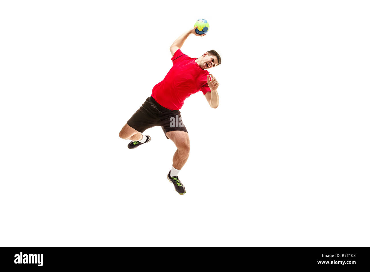 The fit caucasian young male handball player at studio on white ...