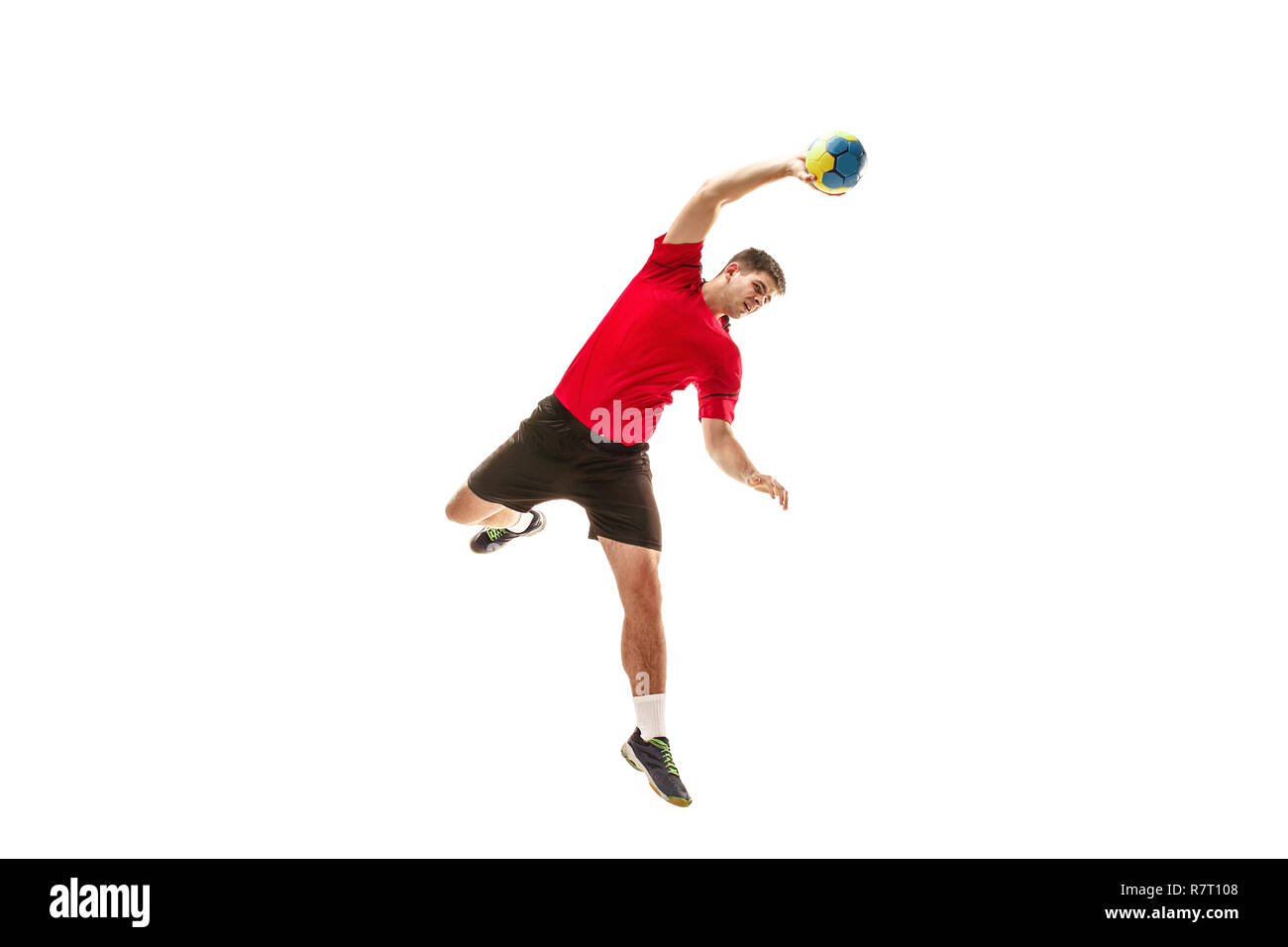 The fit caucasian young male handball player at studio on white ...