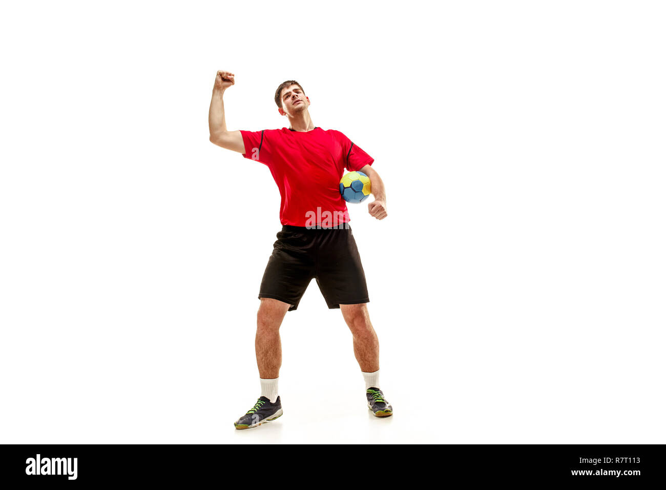 The happy fit caucasian young male handball player at studio on white ...