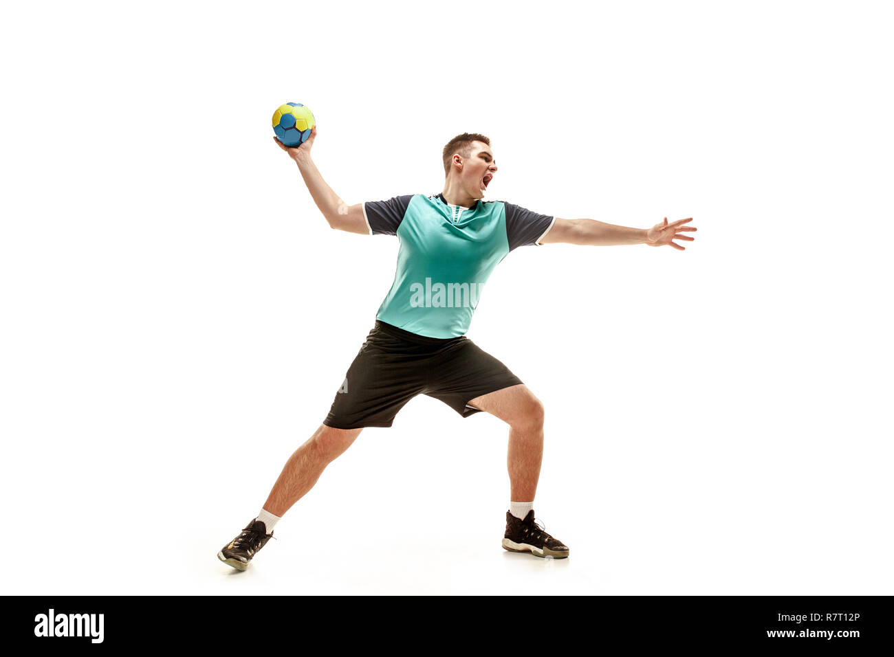 The fit caucasian young male handball player at studio on white ...