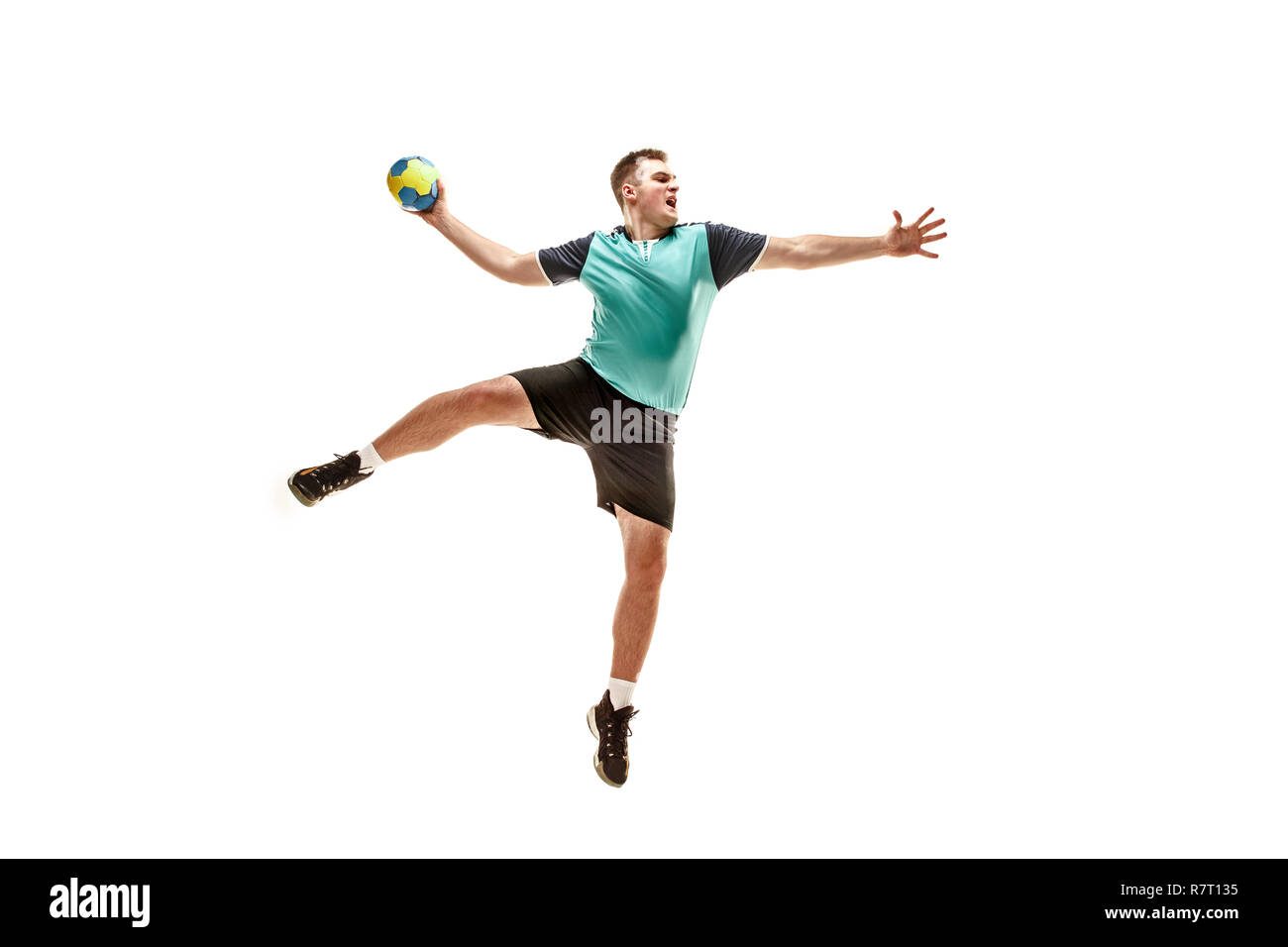 The fit caucasian young male handball player at studio on white ...