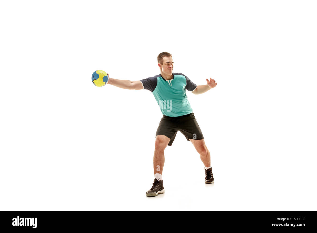 The fit caucasian young male handball player at studio on white ...