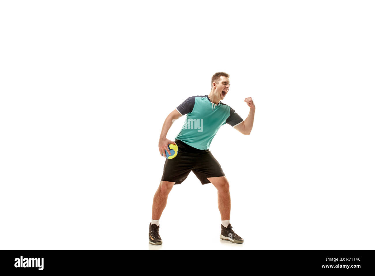 The happy fit caucasian young male handball player at studio on white ...