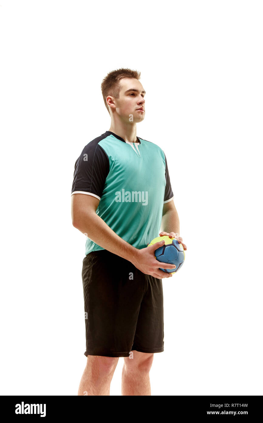 The fit caucasian young male handball player at studio on white ...