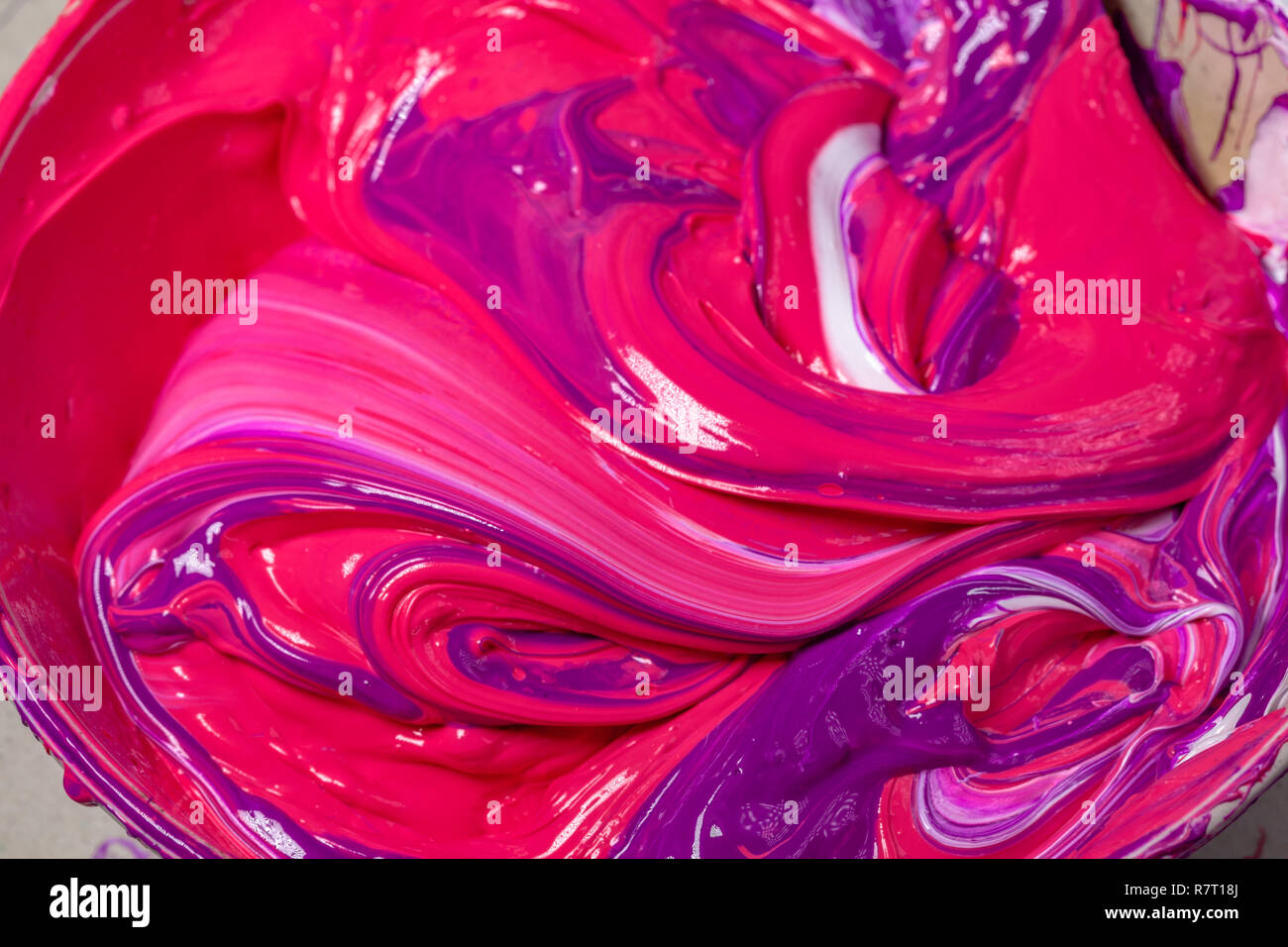 mixing a new light pink color by put white color pink color and purple ...