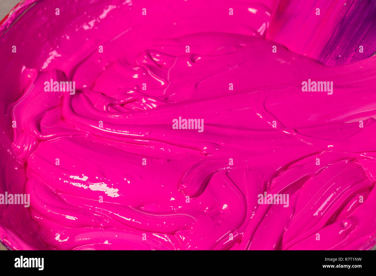 mixing a new light pink color by put white color pink color and purple ...